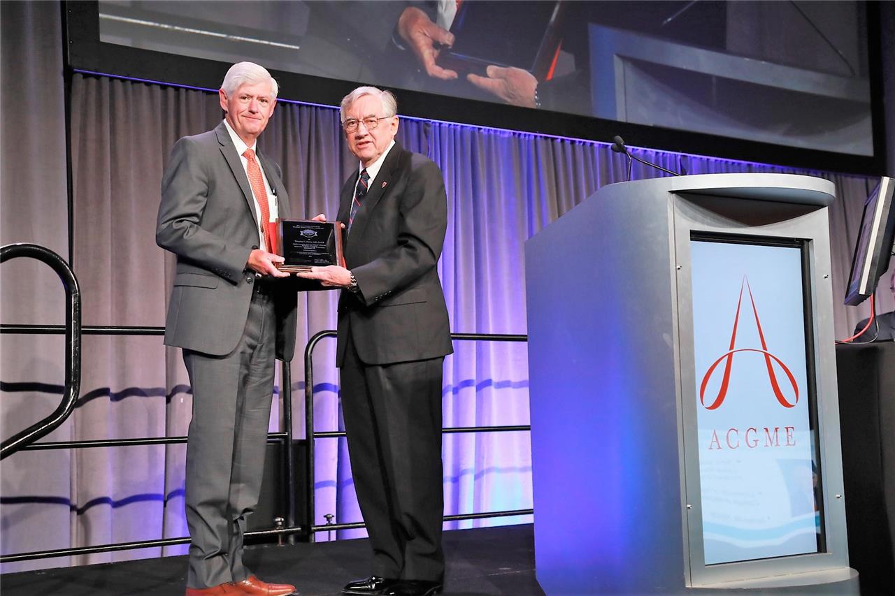 John C. Gienapp Distinguished Service Award Presented to Dr. Timothy C ...